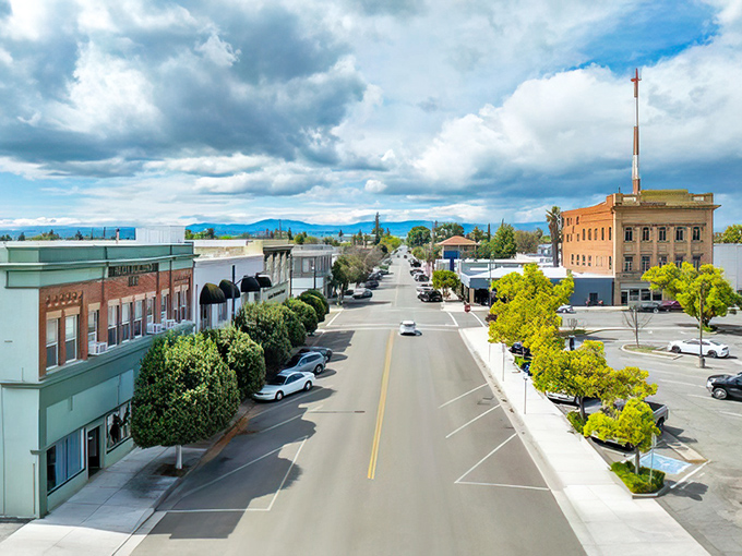 Willows's main street stretches toward distant mountains like a ribbon connecting small-town charm with natural beauty.