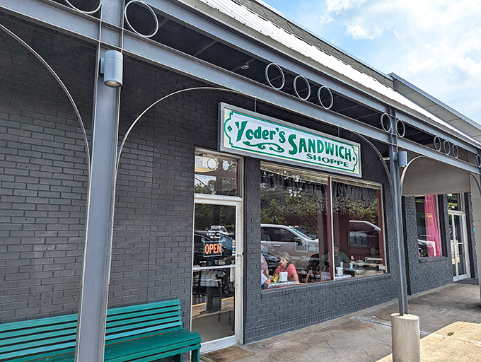 That teal bench outside is like a front porch swing for sandwich enthusiasts. Yoder's charming storefront brings small-town warmth to every bite &ndash; no hurry, just flavor.