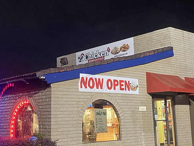 Night falls, but 92 Chicken's "NOW OPEN" sign shines bright, promising crispy, sauce-glazed Korean chicken worth staying up for.