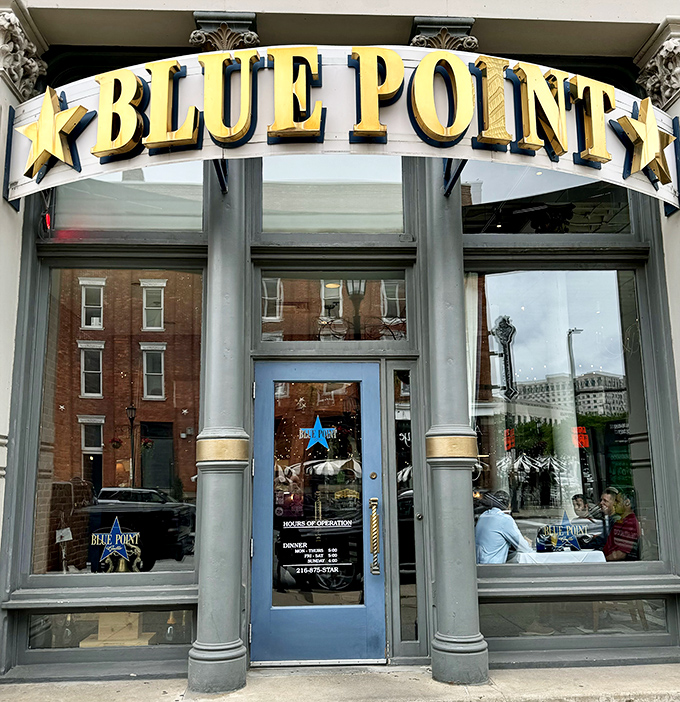 The golden glow of Blue Point's sign illuminates Cleveland evenings, beckoning those wise enough to know where the best oysters hide.