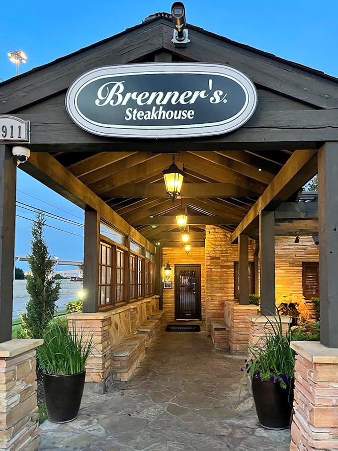 Hanging lights create a magical pathway to steak perfection. Brenner's stone walkway leads to one of Houston's most beloved meat sanctuaries.