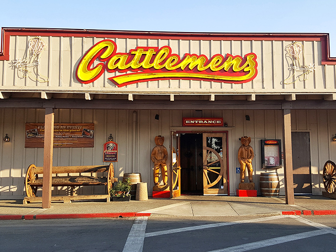 The bright Cattlemen's sign glows like a beacon for hungry travelers seeking refuge from chain restaurant mediocrity.