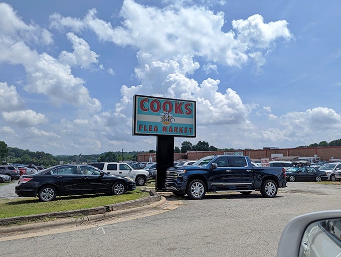 The Cook's Flea Market sign stands tall against Carolina blue skies. That parking lot will soon be filled with cars and empty trunks ready for filling!