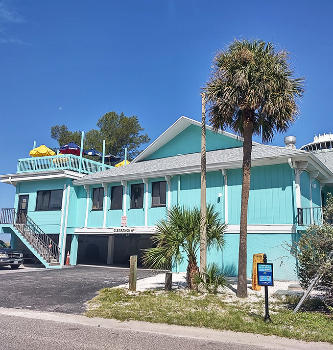 The perfect Florida color palette&mdash;turquoise building, blue sky, and green palm trees. Crabby Bill's looks like a postcard you can eat at!