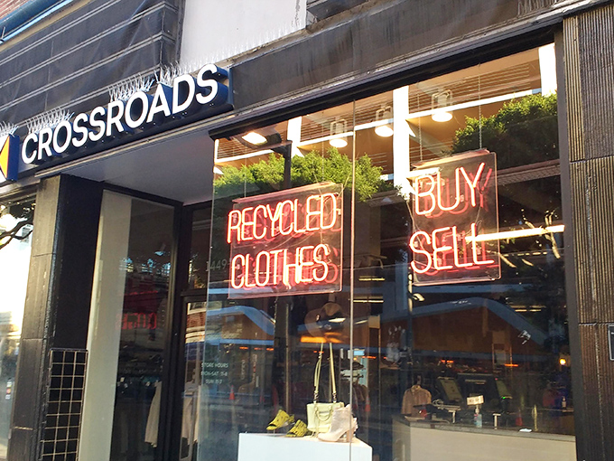Neon signs in the window advertise the treasure hunt within - where yesterday's fashion becomes today's finds.
