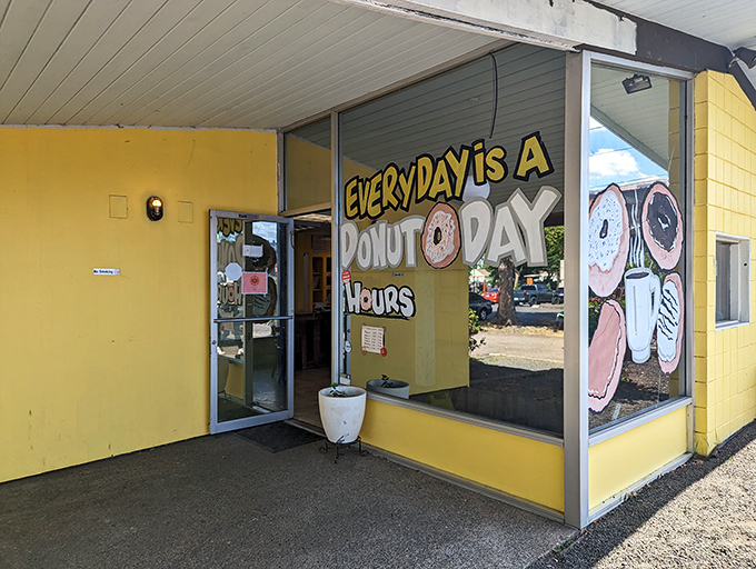 The cheerful facade of Donut Day brightens Beaverton mornings with its promise of fresh-made, hand-crafted treats.