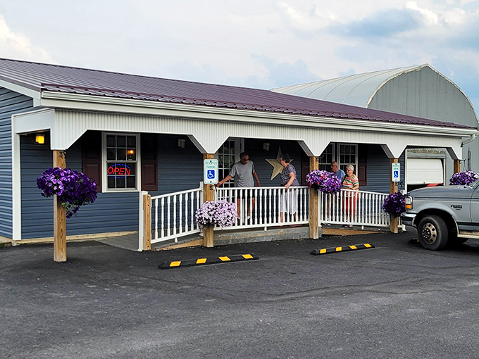 Purple flowers adorn Earlystown Diner's entrance, a colorful welcome to a place where every meal feels homemade.