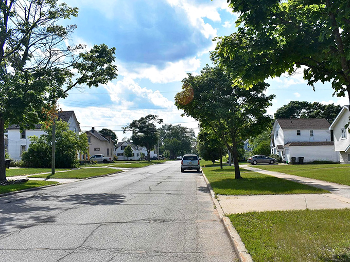 Little Bay de Noc sparkles in the distance, promising the kind of affordable lakefront life that seems too good to be true.