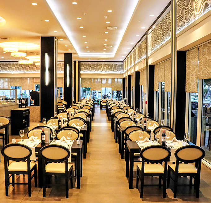 Elegant dining room meets international buffet - where world flavors gather under South Beach sunshine.