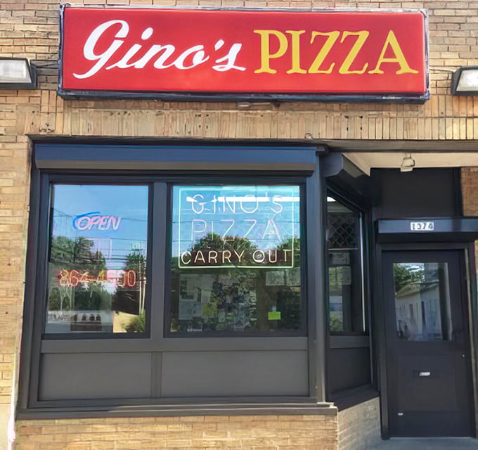 The neon "OPEN" sign at Gino's is Akron's bat signal for pizza lovers. Simple storefront, extraordinary flavors waiting inside.