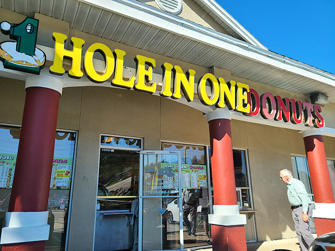 Red columns frame donut perfection. Hole In One proves that sometimes the simplest treats are the winners.