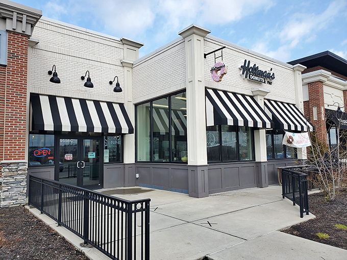 Those classic awnings frame windows into a world where donuts are still made with patience, pride, and plenty of love.