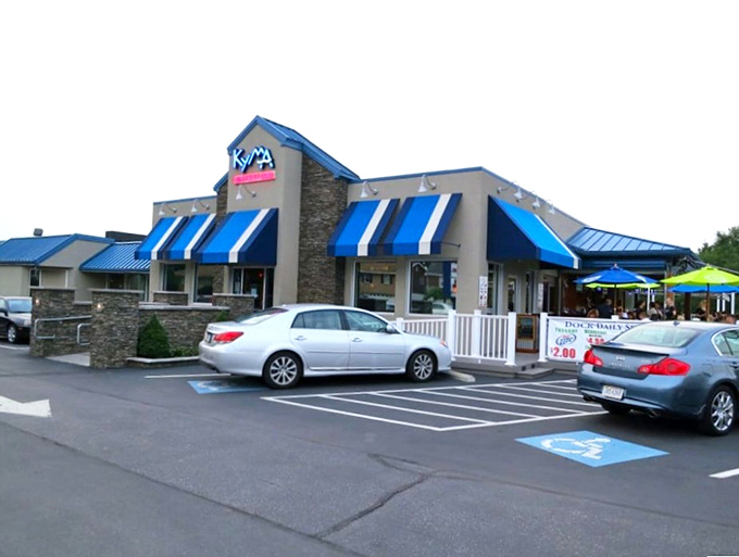 The modern design with natural stone elements reflects the fresh, contemporary approach to Greek-inspired seafood.