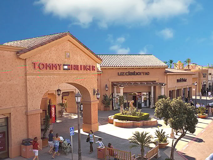 Las Americas Premium Outlets' sign stands tall against the San Diego sky. So close to Mexico, you can practically shop in two countries at once!
