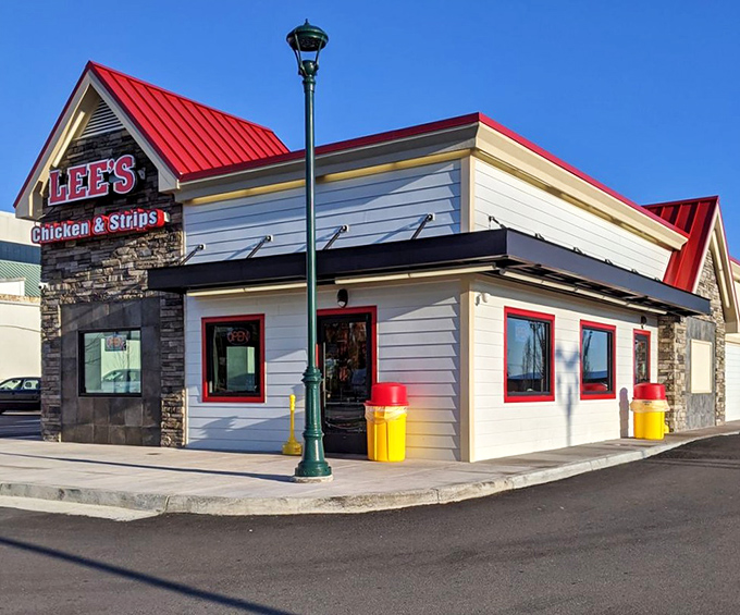 Traditional red roof and stone accents frame a legacy of fried chicken excellence that spans generations.