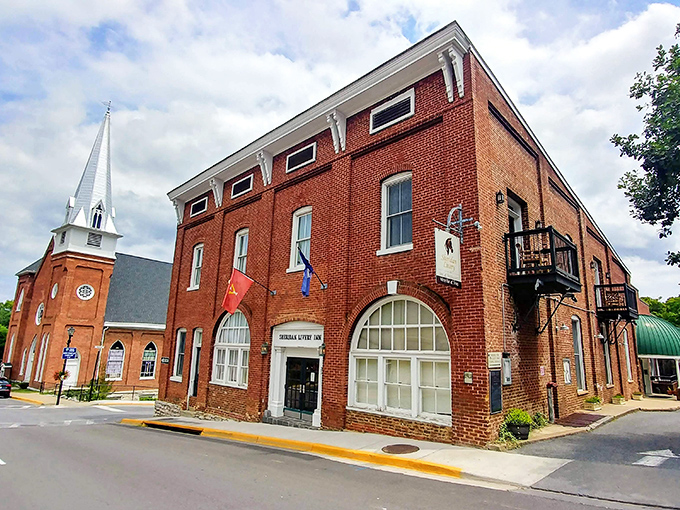 The Sheridan Livery Inn stands proudly on Lexington's corner, serving historical charm with a side of "yes, we have Wi-Fi" modernity.