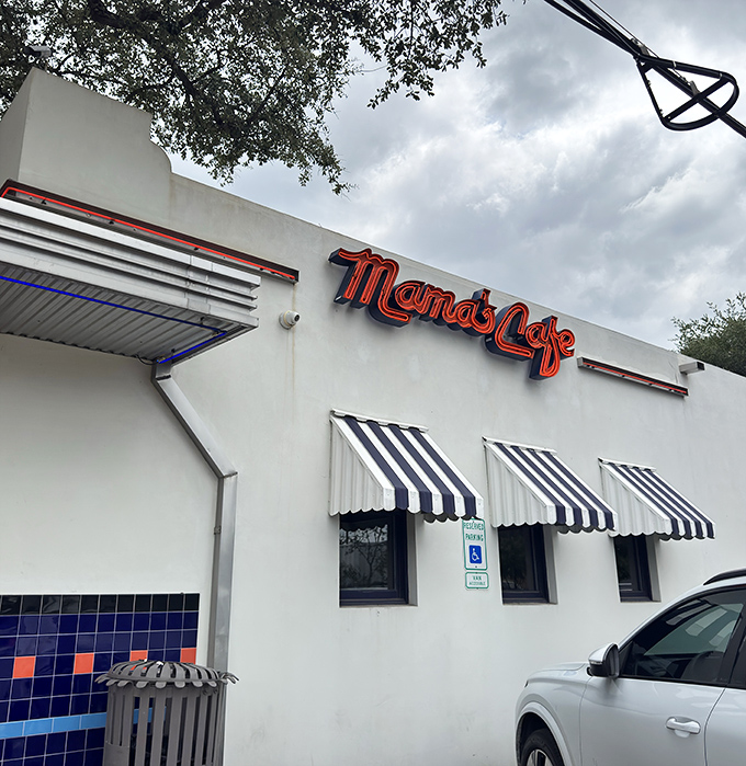 Mama's Cafe exterior: White walls, blue trim, and chicken that tastes like someone's grandmother is back there cooking just for you.