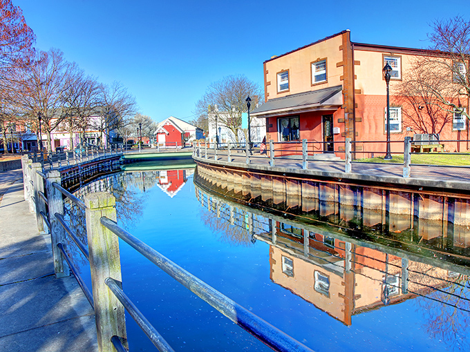 Milford's canal flows like liquid history, where waterfront views come without waterfront price tags.