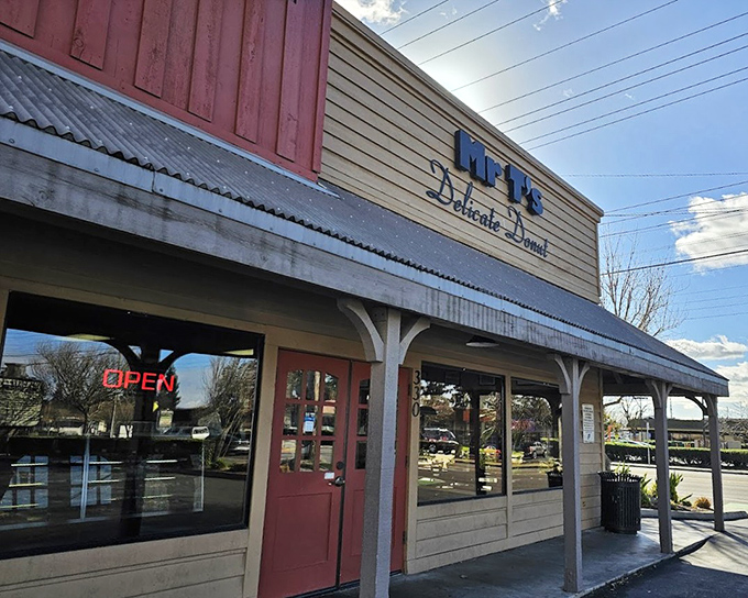 The covered porch suggests leisurely mornings where donuts come with conversation and genuine community connection.