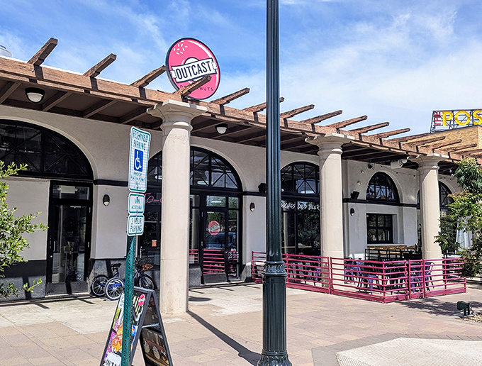 The sophisticated storefront architecture elevates the humble donut to gourmet status with style. 