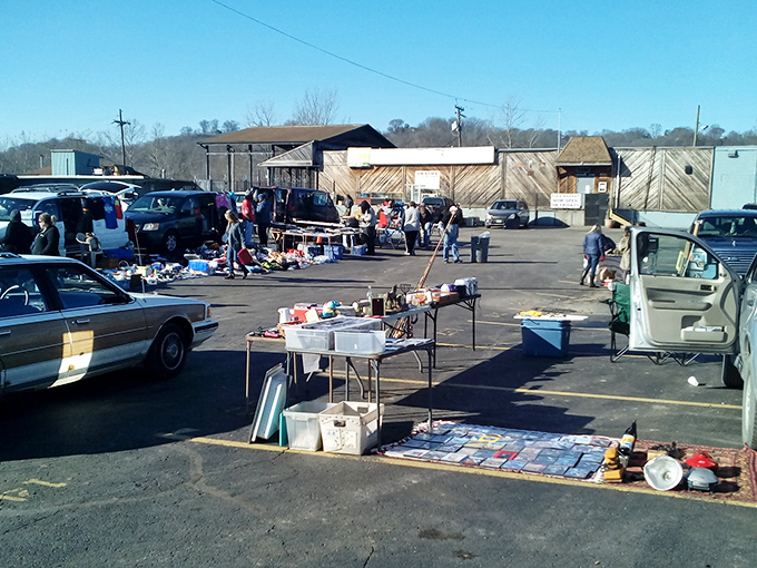 Cars and shoppers mingle in organized chaos, creating the perfect weekend treasure hunting adventure scene.