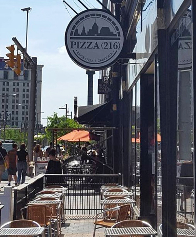 Street-level pizza perfection where city life and comfort food create the perfect downtown dining symphony together.