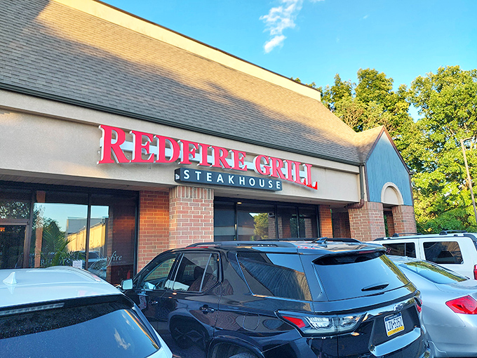 The evening light makes Redfire's sign pop against the twilight sky&mdash;a beacon for hungry Hockessin locals.