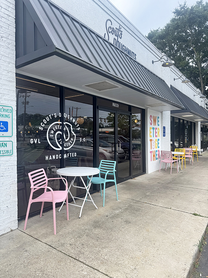 The colorful outdoor seating and clean design create the perfect spot to enjoy handcrafted donuts with friends.