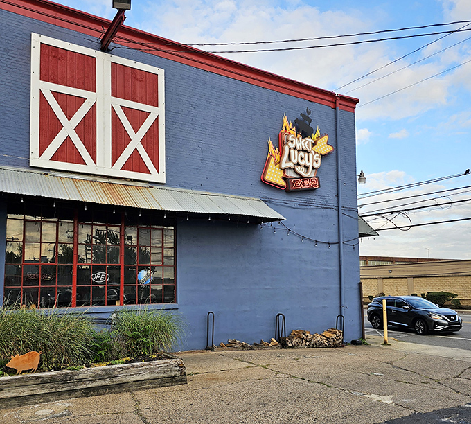 Those red barn doors open to reveal barbecue magic that would make any pitmaster proud.