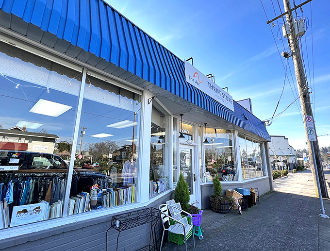 The bright storefront with large windows invites you to peek inside at treasures waiting like presents under a Christmas tree.