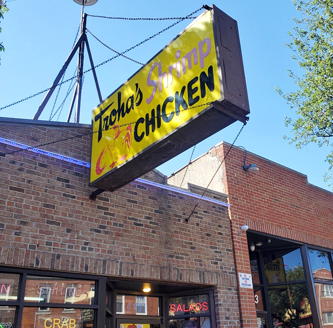 Daylight reveals Troha's brick facade and iconic sign &ndash; a neighborhood landmark that's been feeding generations of seafood lovers.