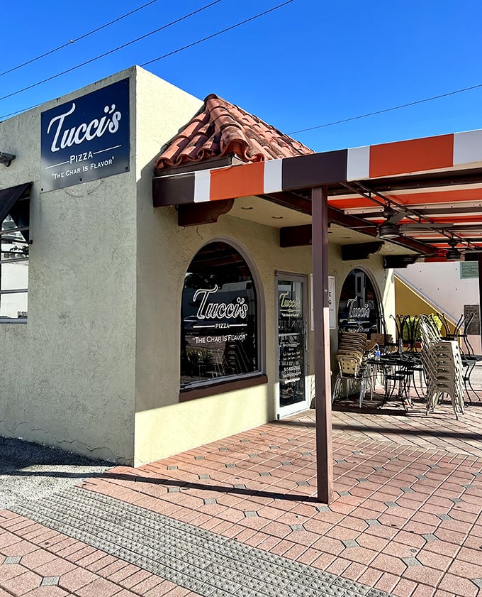 The elegant stonework hints at the old-world pizza traditions being celebrated inside this modern gem.