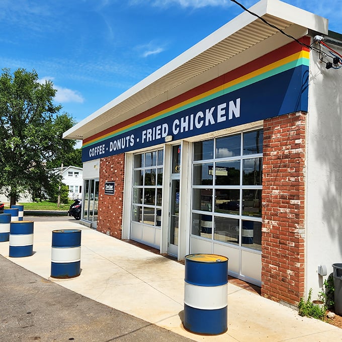 Blue and white barrels stand guard outside Madison's most uniquely named donut destination.
