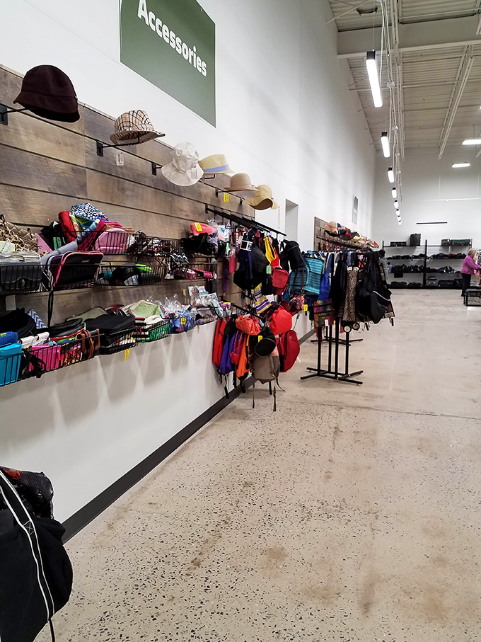The accessories wall&mdash;where hats, scarves, and bags hang like fashionable fruit, ripe for the picking at prices that feel like stealing.