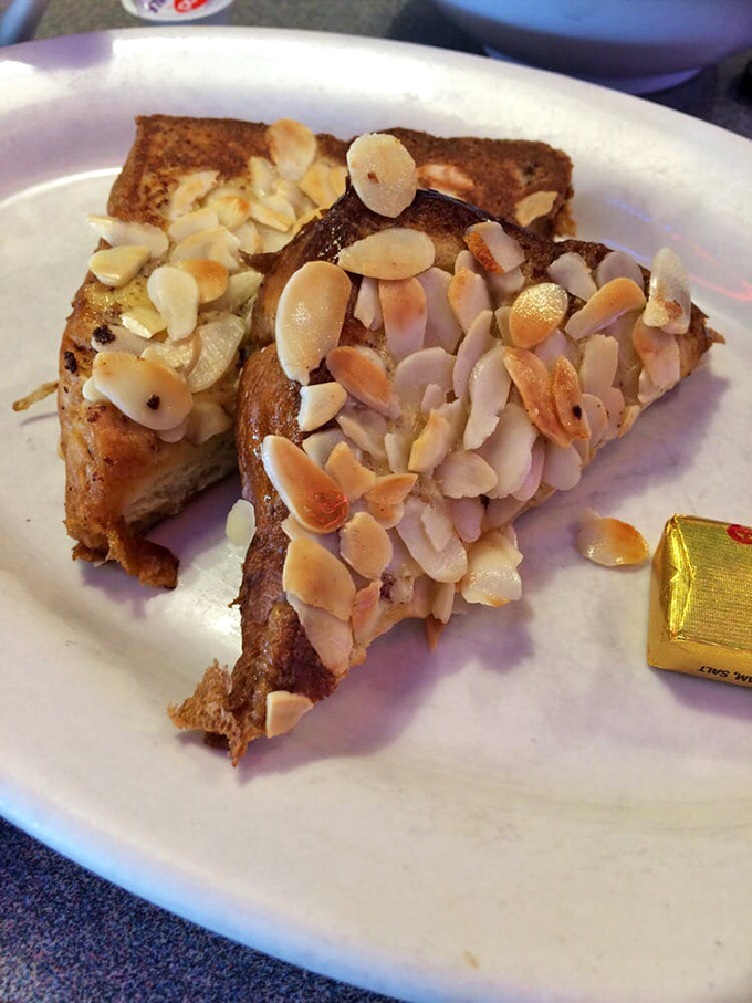 Almond-crusted French toast that makes ordinary breakfast feel like amateur hour. Worth setting your alarm for, even on weekends.