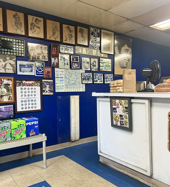Blue walls covered in memories&mdash;the unofficial museum of "remember when" that makes waiting for your sandwich an adventure in local history.