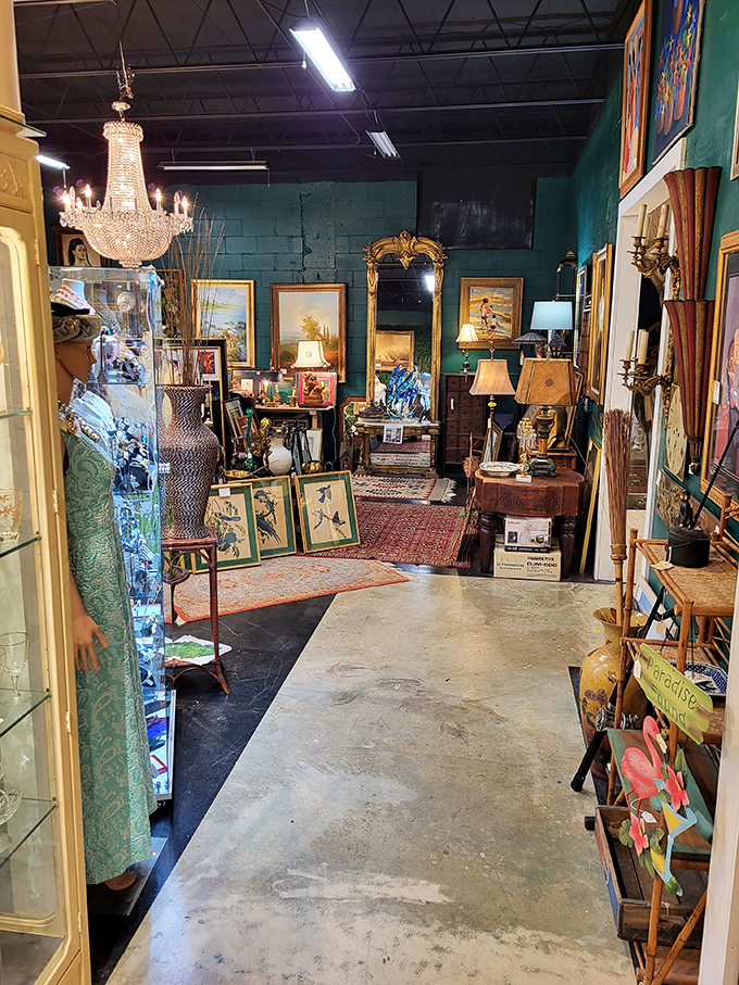 Teal walls and crystal chandeliers frame this gallery-like space where Oriental rugs anchor flights of decorative fancy.