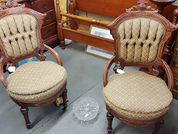 Victorian chairs that invite you to sit like royalty while contemplating whether your living room deserves such aristocratic flair. Your posture would improve immediately.