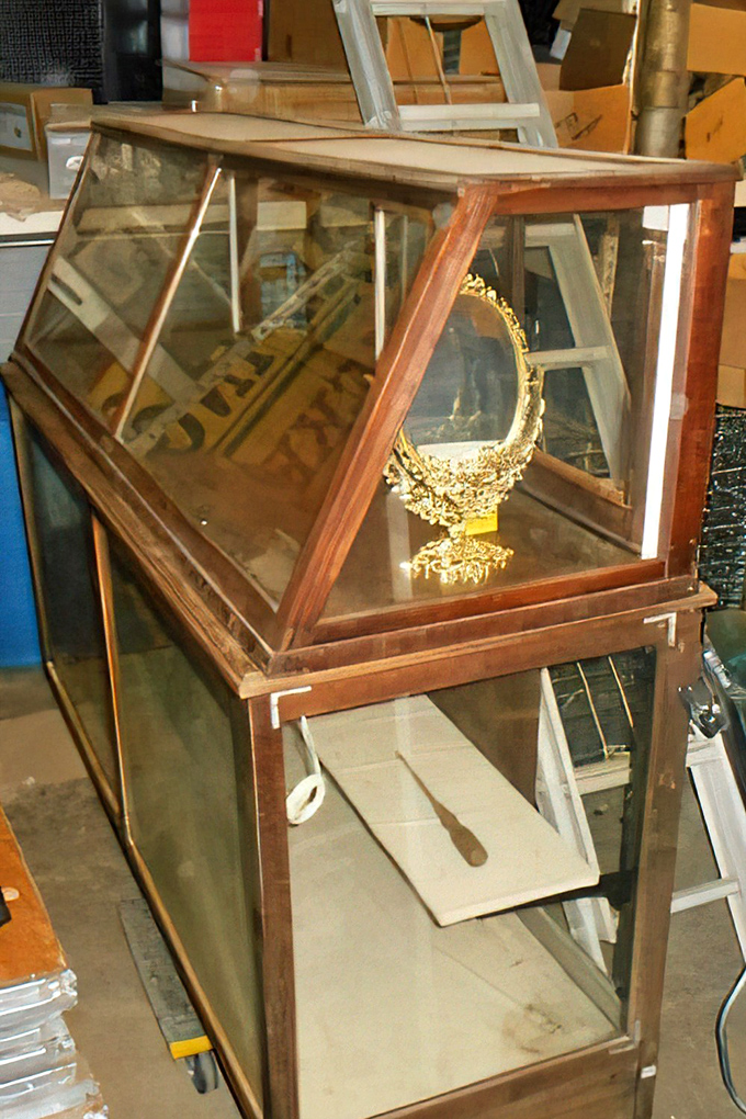 This elegant display case once showcased treasures in someone's home and now awaits a second act in yours.