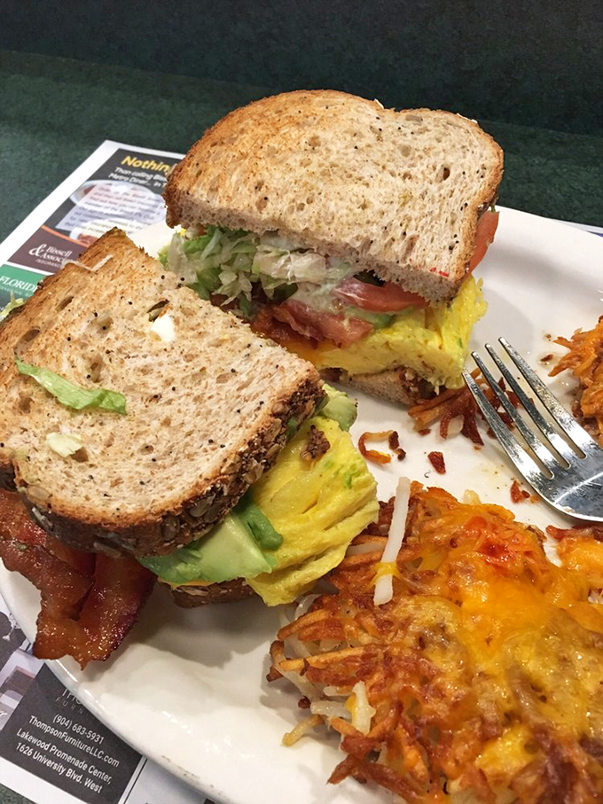 This sandwich isn't just breakfast—it's architecture. Layers of egg, avocado, and bacon creating the Taj Mahal of morning meals.
