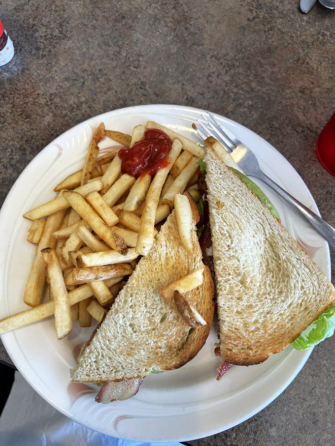 The humble BLT, elevated to art form. Those fries aren't a side dish&mdash;they're co-stars in this lunchtime production.