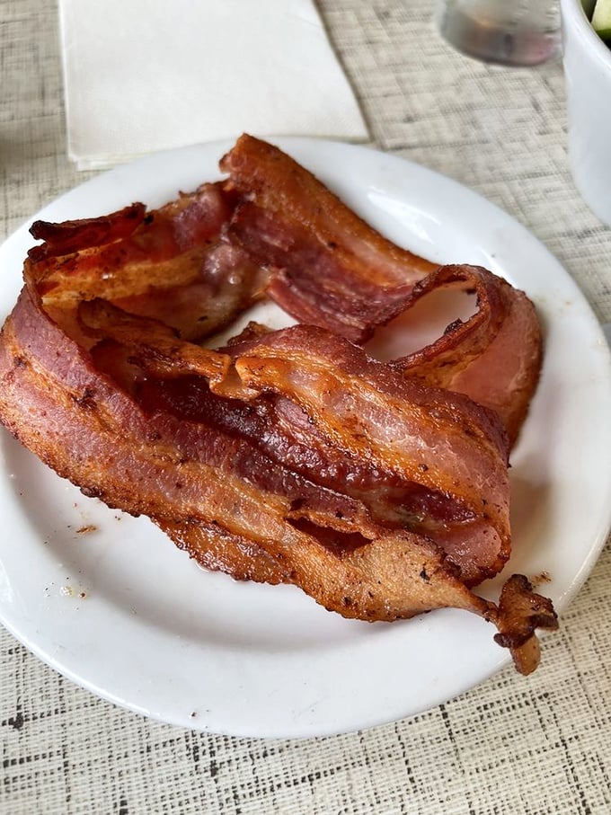 Bacon cooked to crispy perfection—the kind that shatters satisfyingly with every bite you take.