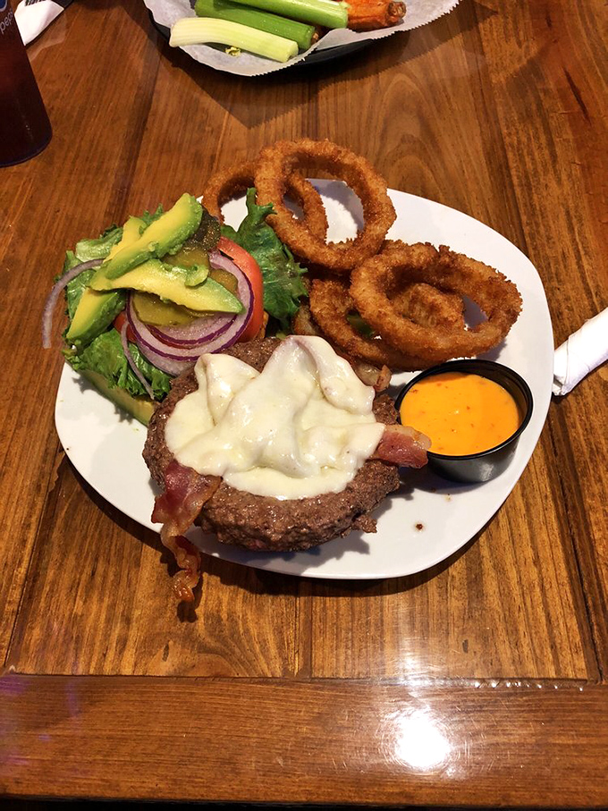 A burger that requires both hands and a strategy. The avocado and bacon are just showing off at this point.