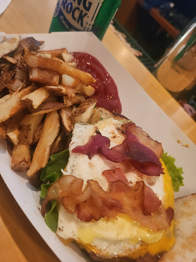 The perfect breakfast burger doesn't exi&mdash; Oh wait, here it is, complete with a sunny-side-up egg that's basically wearing a cape. Those fries aren't sidekicks; they're co-stars.