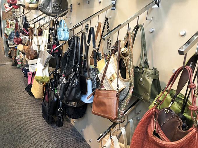 Handbag heaven! Designer lookalikes mingle with genuine vintage finds in this leather and fabric social gathering on hooks.