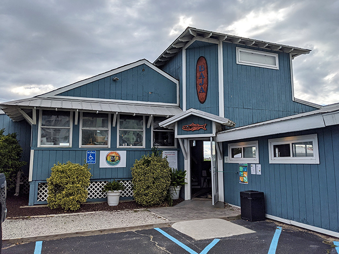 Baja Restaurant's blue exterior promises seafood as fresh as the ocean breeze. Inside, fish tacos taste better with salt air and vacation vibes.