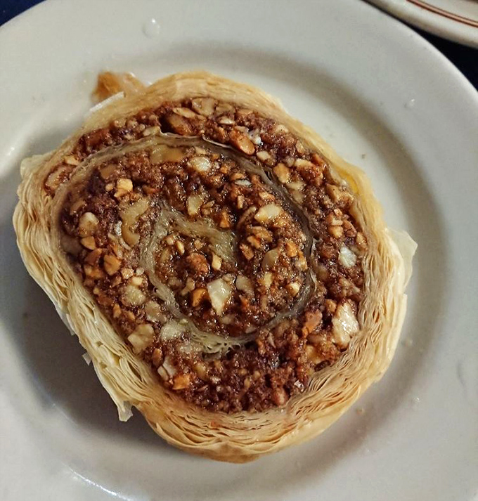 Baklava done right &ndash; layers of phyllo as delicate as butterfly wings, cradling honey-soaked nuts in what might be the world's most perfect dessert architecture.