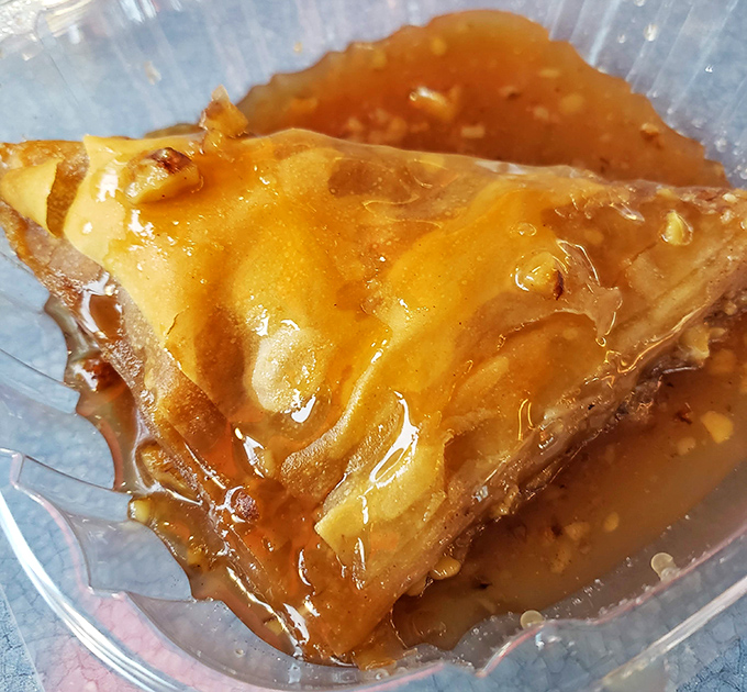 Baklava layers reveal honeyed secrets between flaky pastry sheets, creating sweet architecture that melts hearts and taste buds.