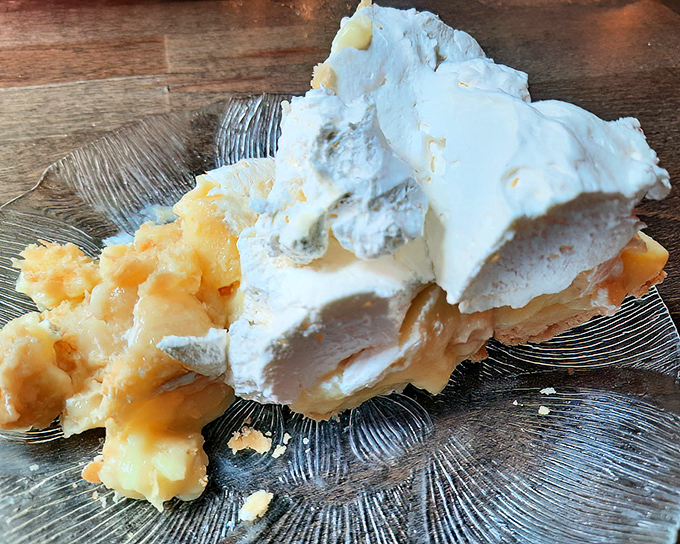 Banana cream pie so heavenly it should require a permission slip. That mountain of whipped cream isn't just a topping&mdash;it's a lifestyle choice.