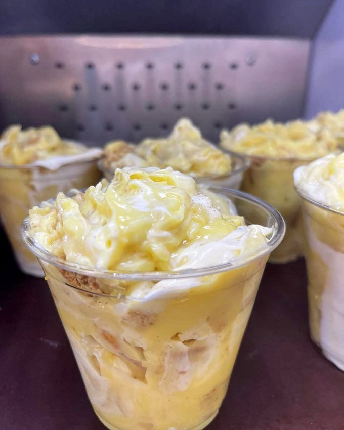 Banana pudding cups lined up like soldiers ready for dessert duty. Those vanilla wafers peeking through are calling my name!